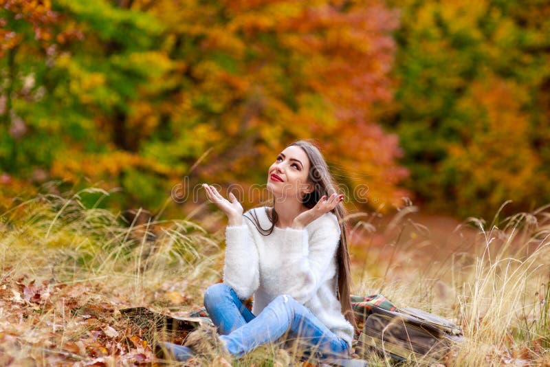Woman Seated on the Ground with Arms Open Stock Photo - Image of golden ...
