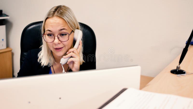 Woman Secretary Chatting on the Phone in the Office. Woman in the ...