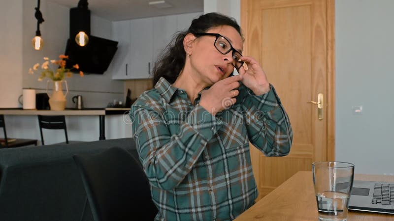 Woman Multitasking in a Home Office Environment during a Busy Workday ...