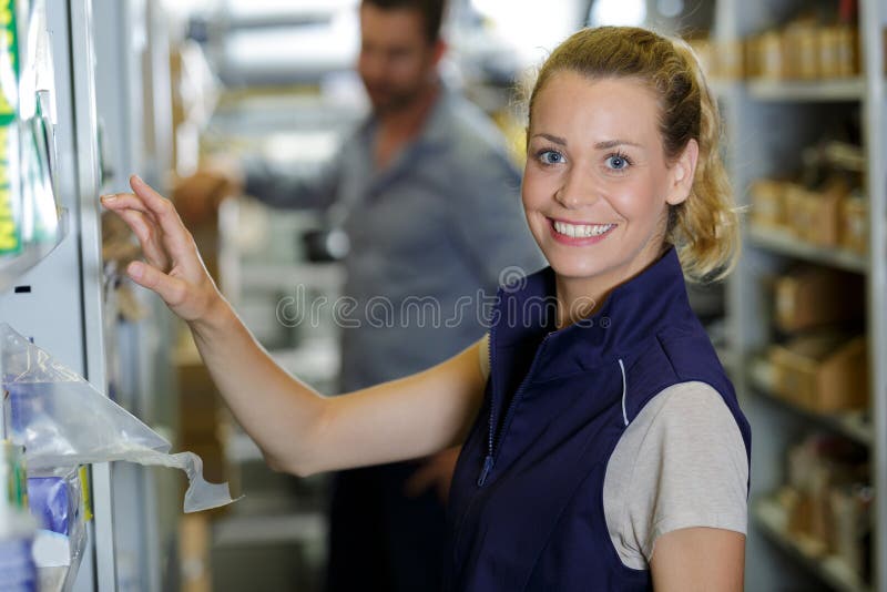 Woman Selling at Warehouse Store Stock Photo - Image of cheerful ...