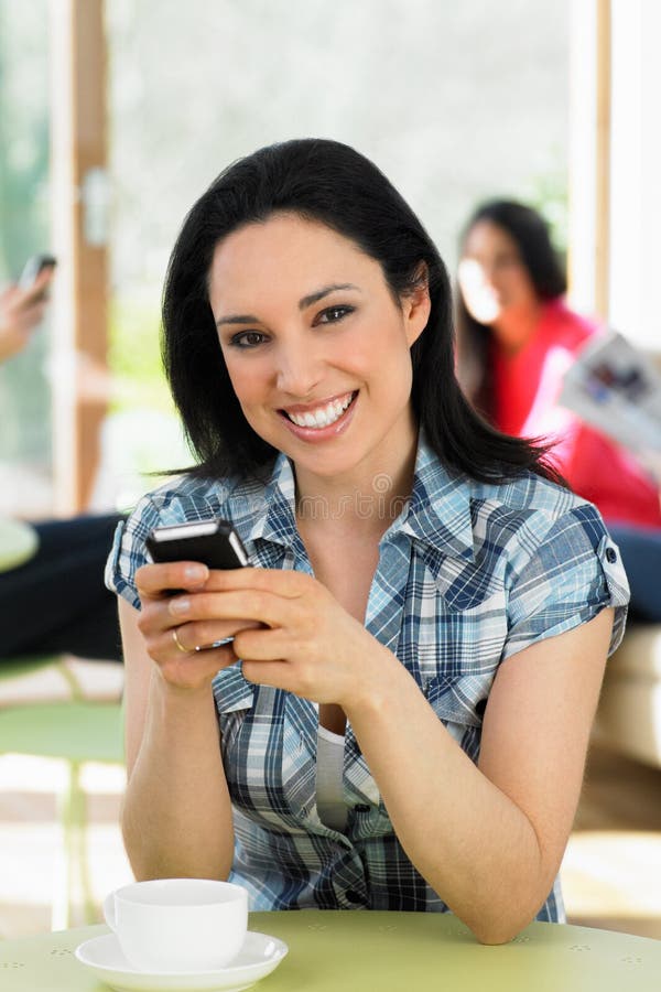 Woman Sending Text Message in Cafe Stock Photo - Image of text ...