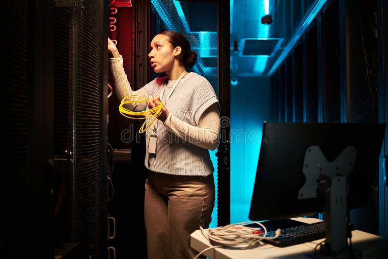 Woman Managing Server Room Equipment with Determination Stock Photo - Image of cable, operate ...