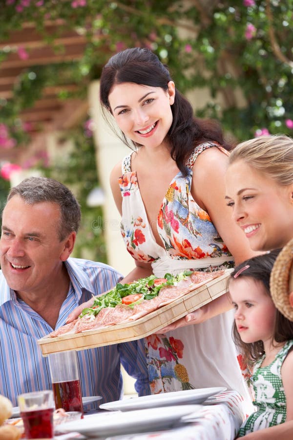 Woman Serving at Multi Generation Family Meal Stock Photo - Image of ...