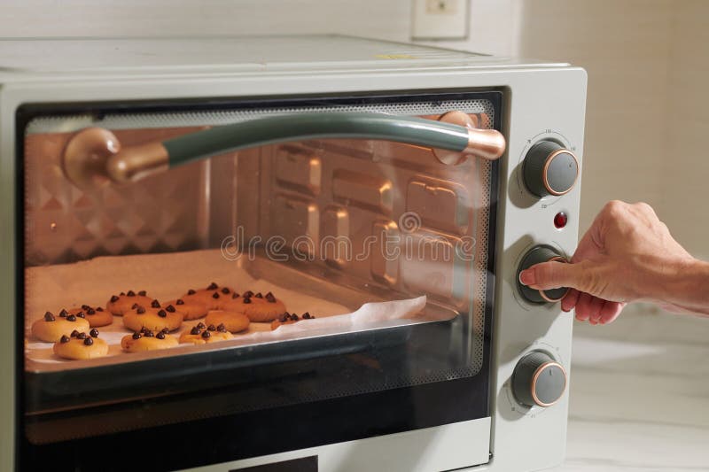 Woman Setting Timer on Oven Stock Photo - Image of housewife, door ...