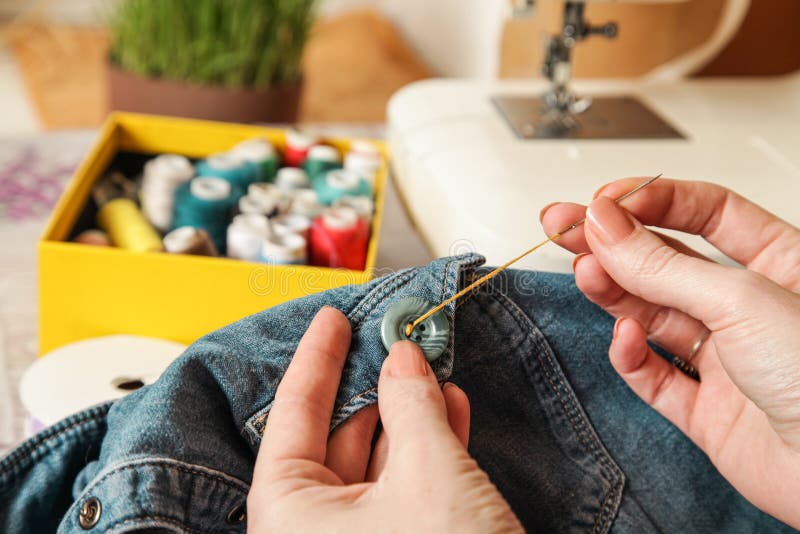 Thread Needle Sewing Button Jeans. Close-up Stock Photo - Image of ...
