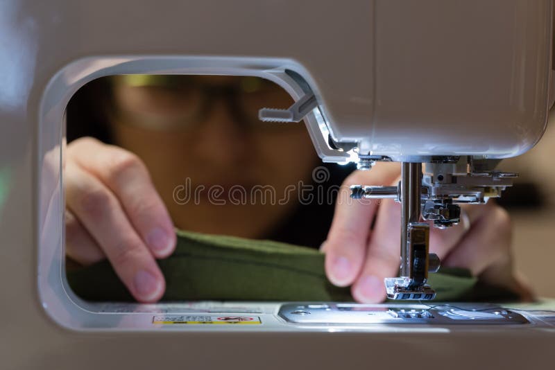 Woman Sewing in Dark stock image. Image of hands, detail - 55604335