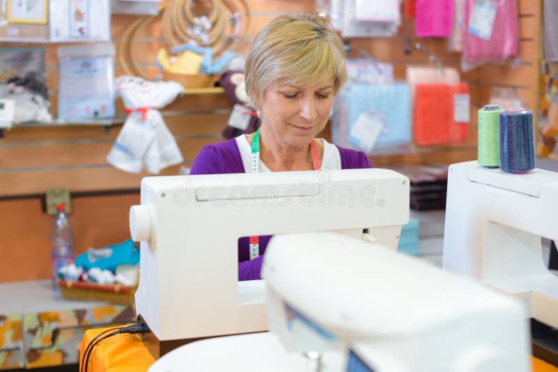 Woman Sewing on Sewing-machine Stock Image - Image of happy, sempstress ...