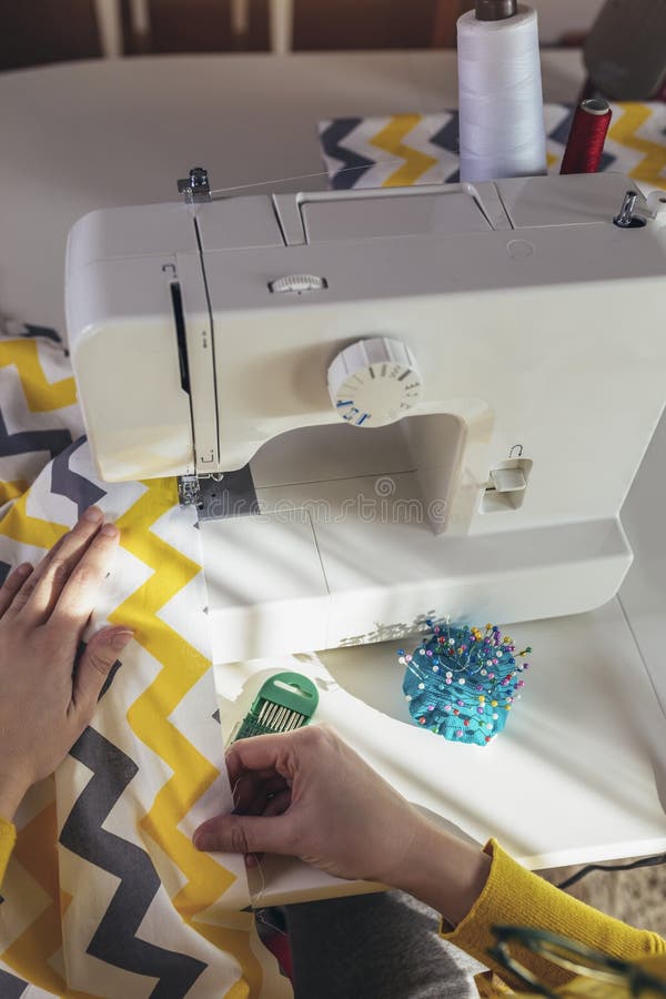 Woman Sewing on a Sewing Machine at Her Home Stock Photo - Image of ...