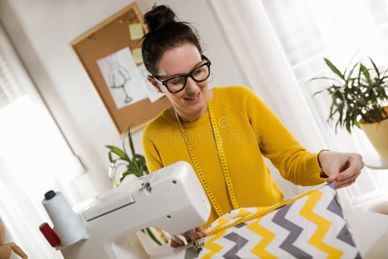 Woman Sewing on a Sewing Machine at Her Home Stock Photo - Image of ...