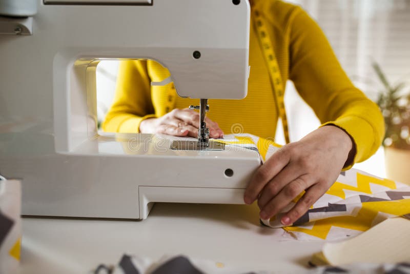 Woman Sewing on a Sewing Machine at Her Home Stock Photo - Image of ...