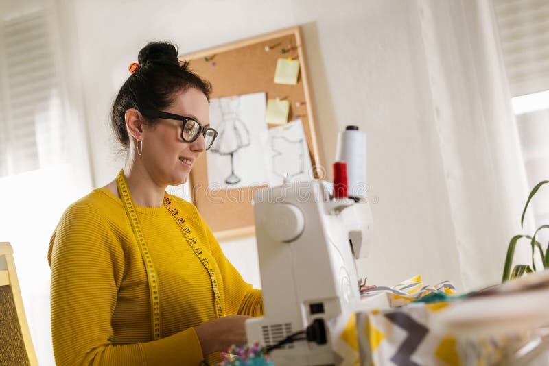 Woman Sewing on a Sewing Machine at Her Home Stock Image - Image of ...