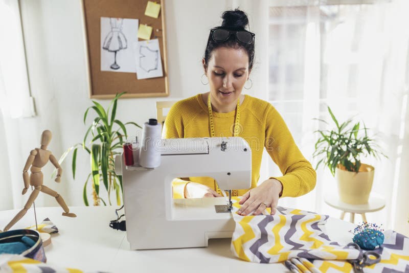 Woman Sewing on a Sewing Machine at Her Home. Stock Image - Image of ...