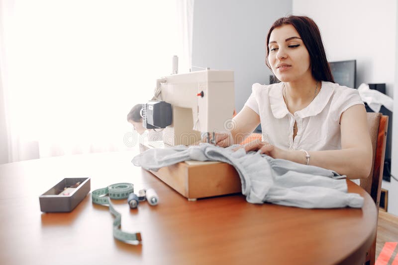 Woman Sewing on a Sewing Machine Stock Photo - Image of designer ...