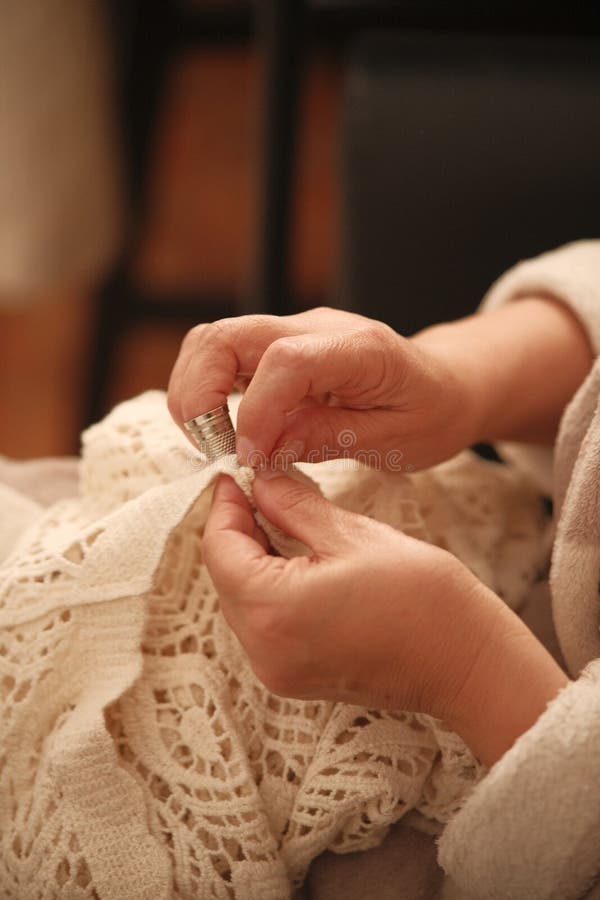 Woman sewing a wool jacket stock photo. Image of jacket - 290538320