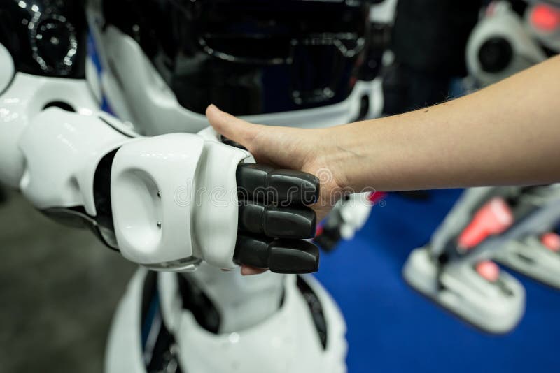 A Woman Shaking Hands with a Robot. Stock Image - Image of human, woman ...