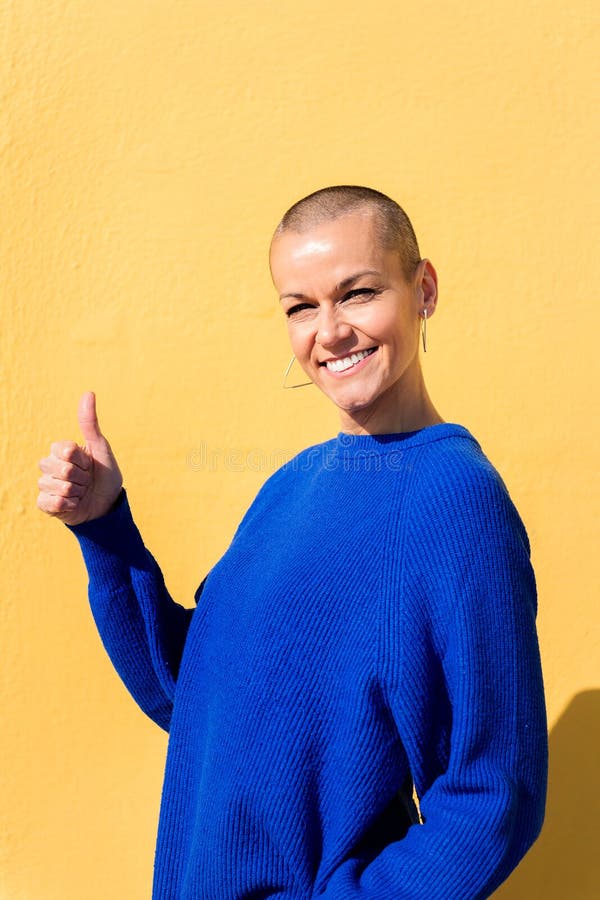 Woman With A Shaved Head Smiling Looking At Camera Stock Image Image