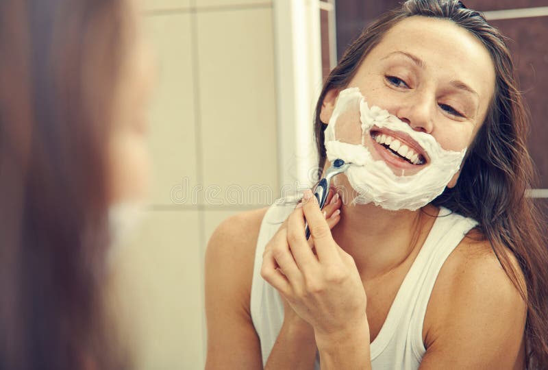 Woman shaving her face stock image. Image of cream, care - 68403595