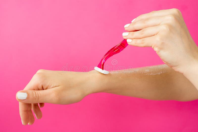Red Shaver in Woman Hand Against Blue Background Stock Photo - Image of ...