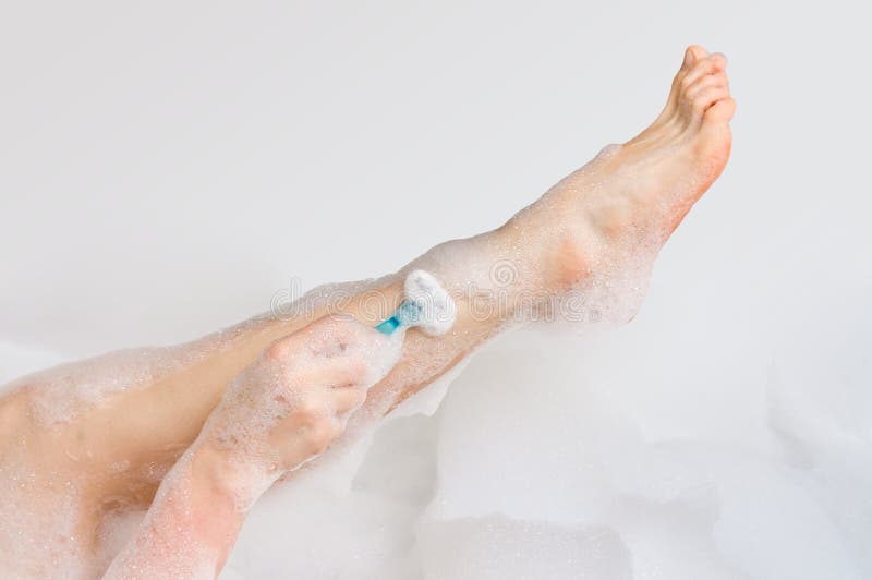 Woman Shaving Legs with Razor in Bathroom Stock Photo - Image of health ...