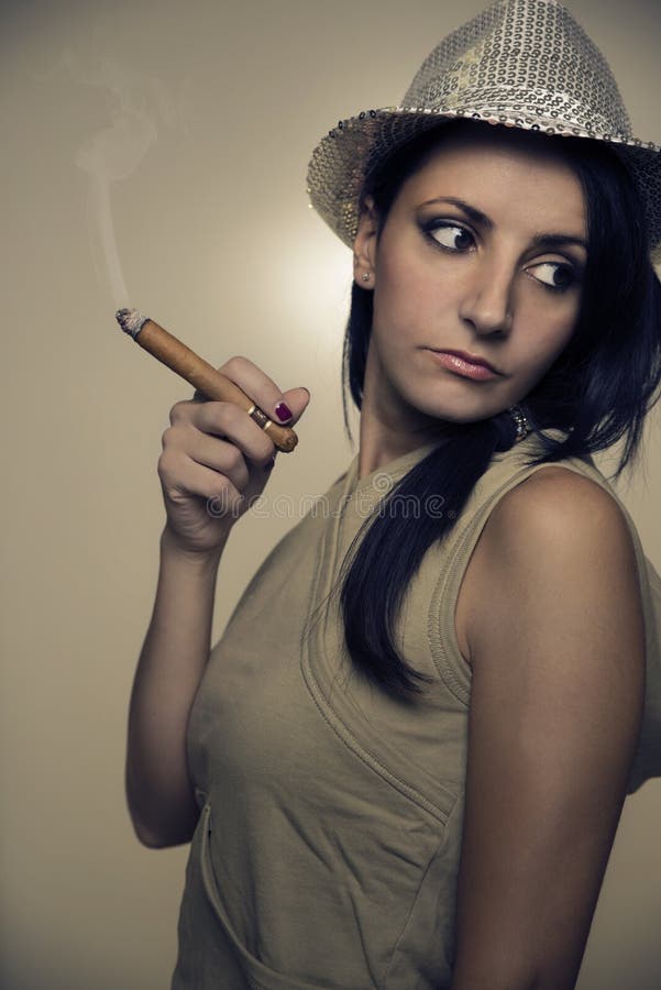 Woman with Shiny Hat Smoking a Cigar Stock Photo - Image of girl ...