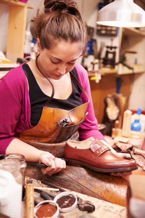 Shoemaker Cutting and Shaping Wood To Make Shoe Lasts Stock Photo ...