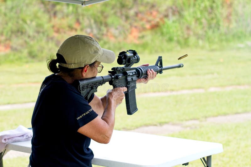 A Woman Shooting an AR-15 Rifle Editorial Image - Image of bear ...