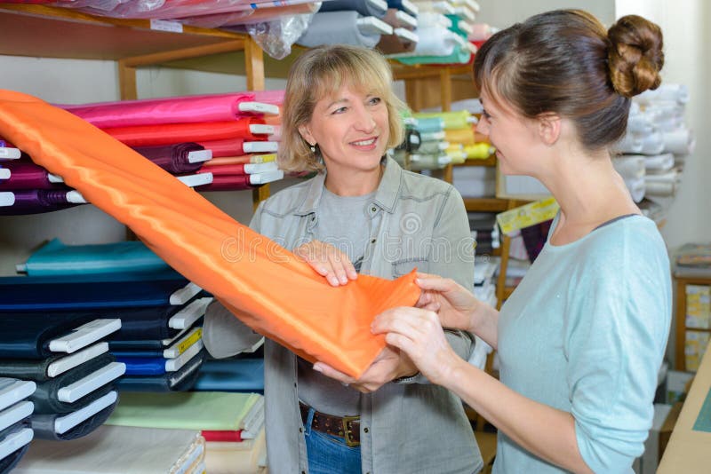Woman Shopping for Fabric in Textiles Shop Stock Photo - Image of ...