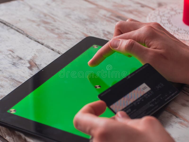 Woman Shopping Using Tablet Pc and Credit Card. Empty Green Screen ...