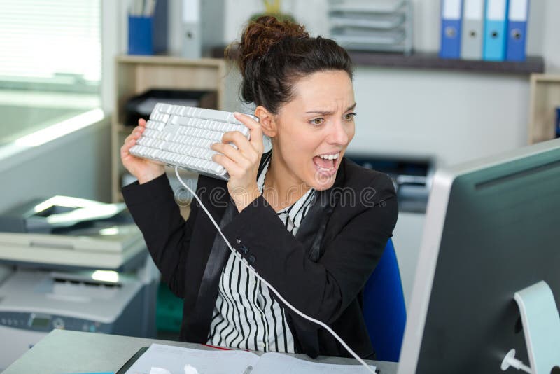Woman Shouting at Computer Poised To Attack it with Keyboard Stock ...
