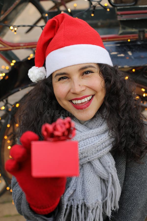 Woman Showing a Cute Christmas Present Stock Photo - Image of december ...