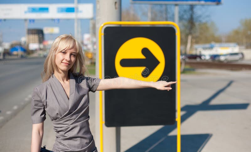 Woman showing a direction stock photo. Image of design - 16264560