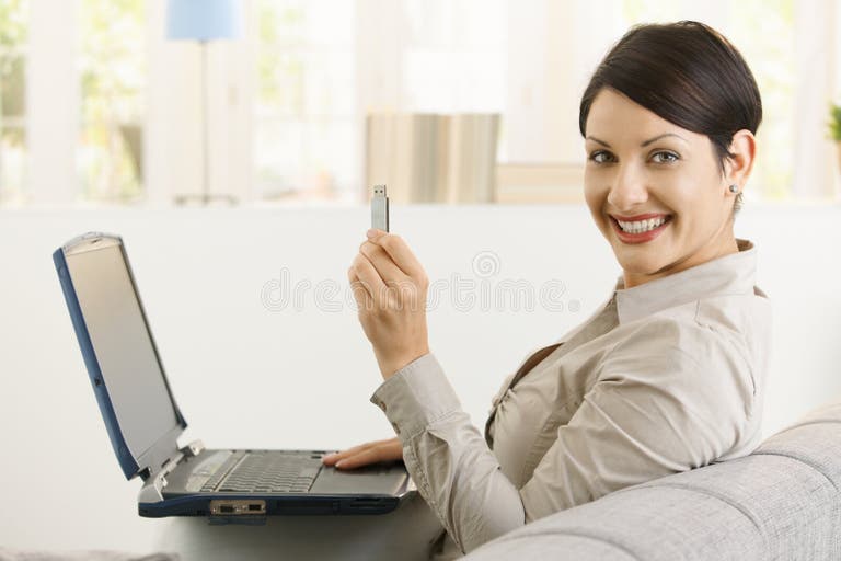 Woman showing flash drive stock photo. Image of camera - 16808552