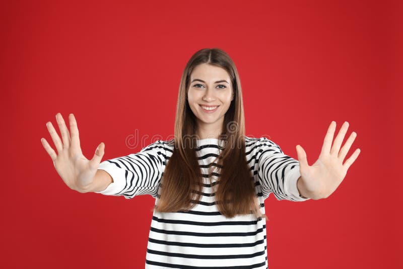 Woman Showing Number Ten with Her Hands on Red Background Stock Photo ...