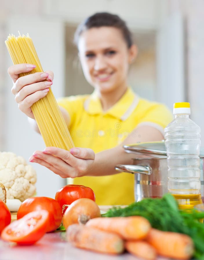 Woman Showing Uncooked Pasta Stock Image - Image of diets, fast: 29952129