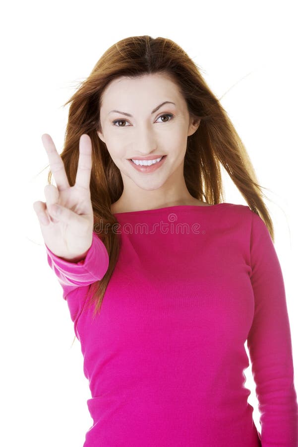 Woman showing victory sign stock photo. Image of hand - 30783310