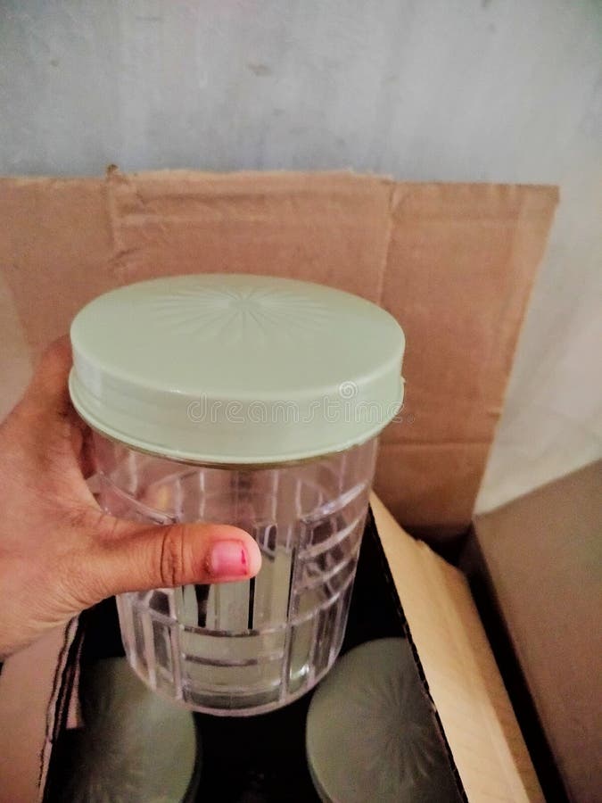 A Woman Shows an Acrylic Jar Made from a Cardboard Box. Stock Image ...