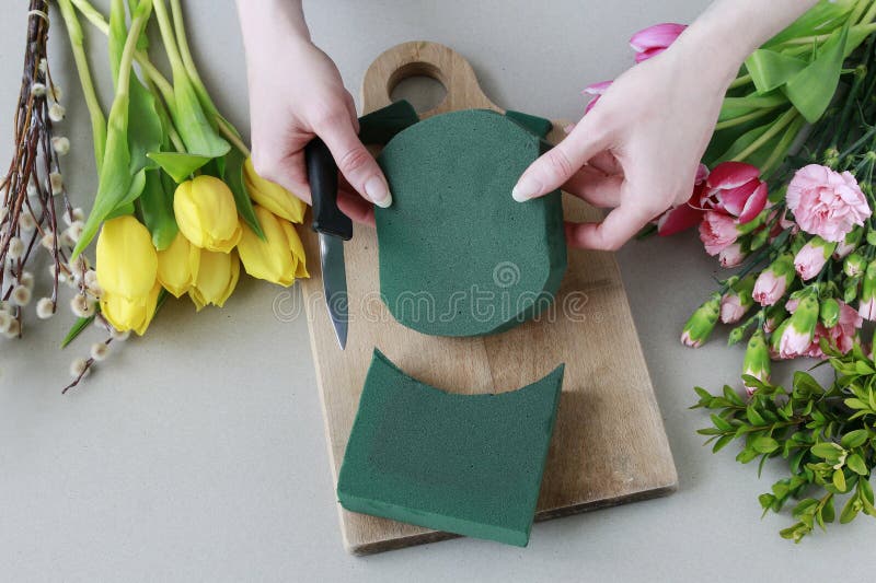Woman Shows How To Make Beautiful Floral Arrangement with Tulip and ... Woman Shows How To Make Beautiful Floral Arrangement with Tulip and ...