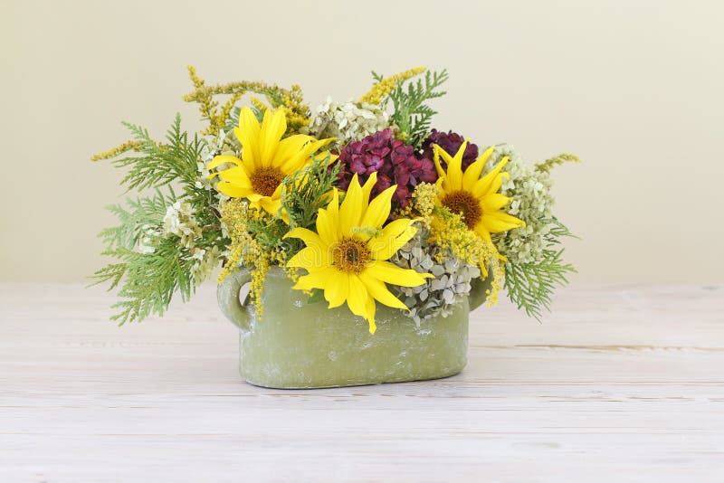 Woman Shows How To Make Floral Arrangement with Sunflowers and ... Woman Shows How To Make Floral Arrangement with Sunflowers and ...