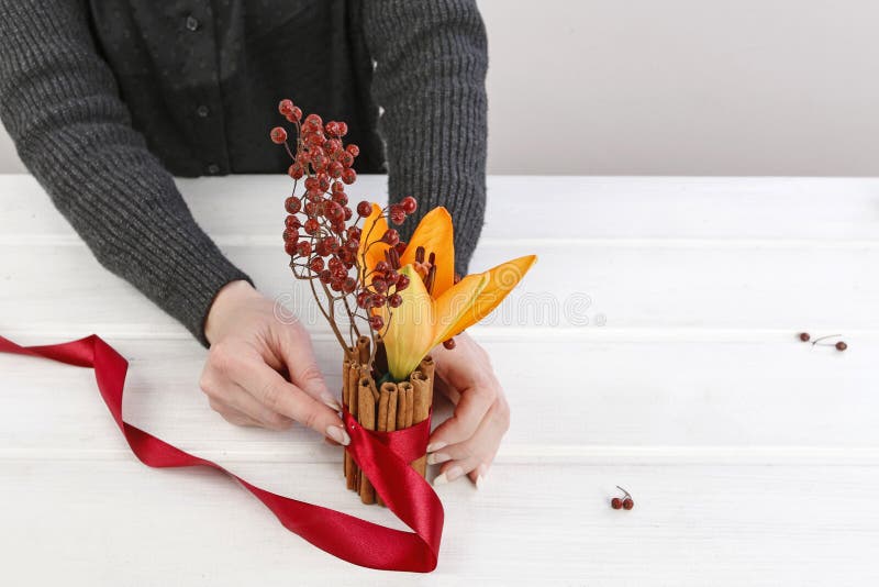 Woman Shows How To Make Modern, Minimalistic Floral Decoration Stock ... Woman Shows How To Make Modern, Minimalistic Floral Decoration Stock ...