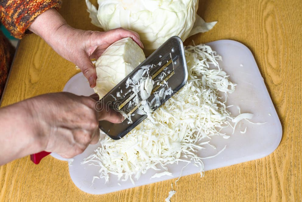 Woman Shredding Cabbage on Cutting Board Stock Image - Image of ...