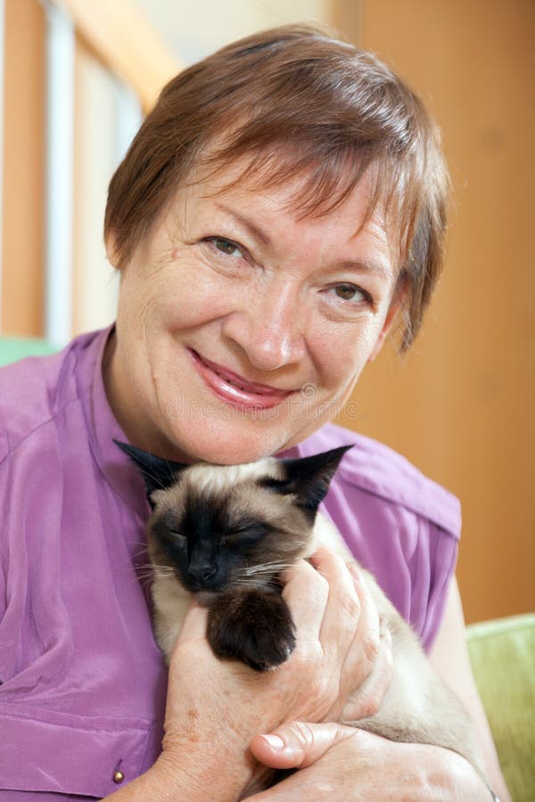 Woman with Siamese kitten stock photo. Image of sitting - 49609294