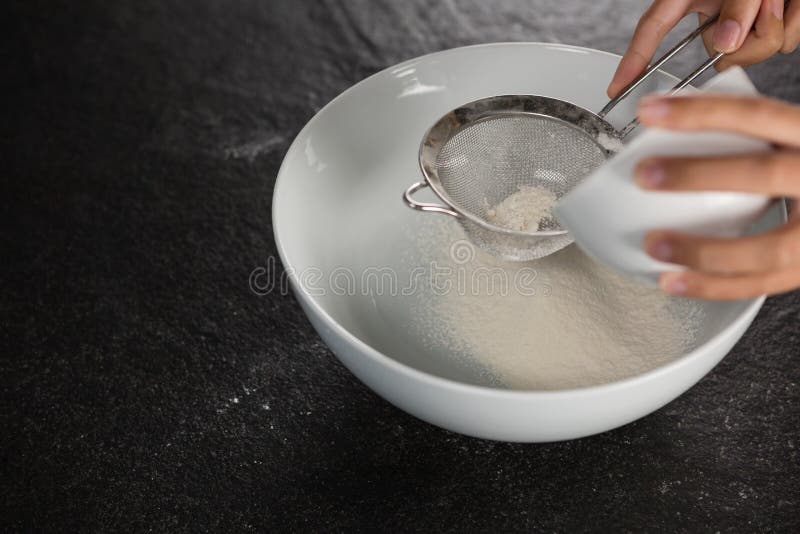 Woman Sieving Flour into the Bowl Stock Photo - Image of female ...