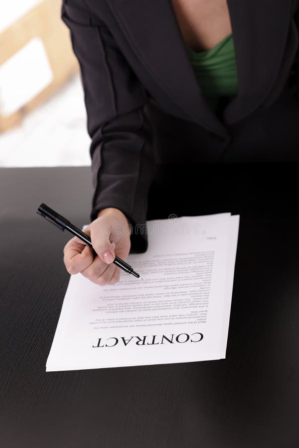 Woman signing contract stock photo. Image of hands, young - 22022194