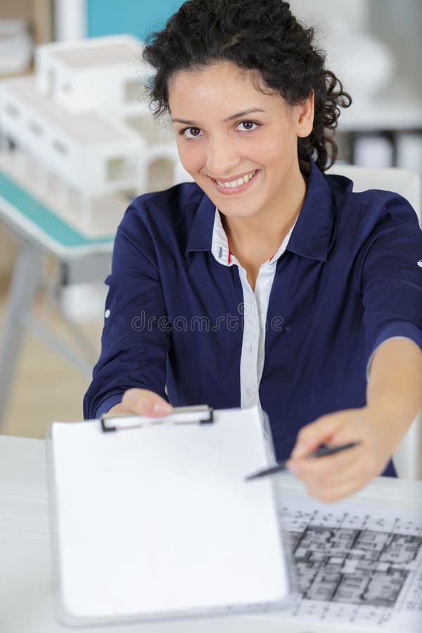 Woman signing contract stock photo. Image of friendly - 300770564
