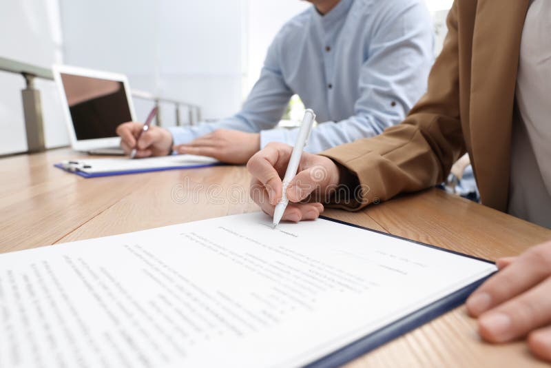 Woman Signing Contract at Table in Office, Closeup Stock Photo - Image ...