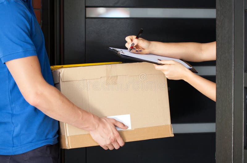 Woman Signing Parcel Delivery Papers Stock Image - Image of home, post ...
