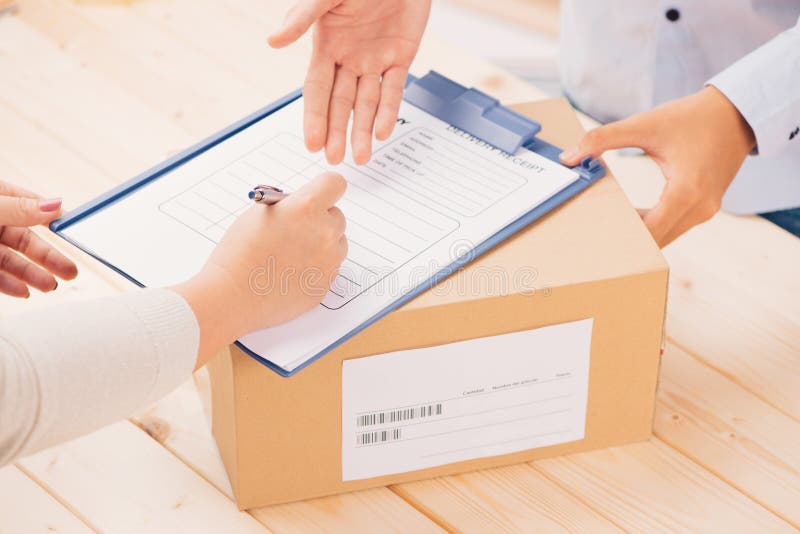 Woman Signing Receipt of Delivery Package, Close Up Stock Image - Image ...