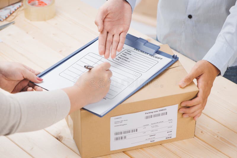 Woman Signing Receipt of Delivery Package, Close Up Stock Photo - Image ...