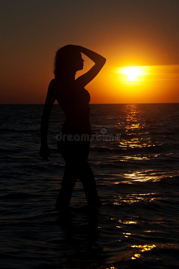 Woman Silhouette Against Sunset Stock Photo - Image of nightfall ...