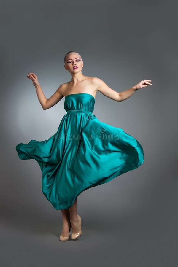 Woman In Silk Dress Waving On Wind Flying And Fluttering Gown Cloth